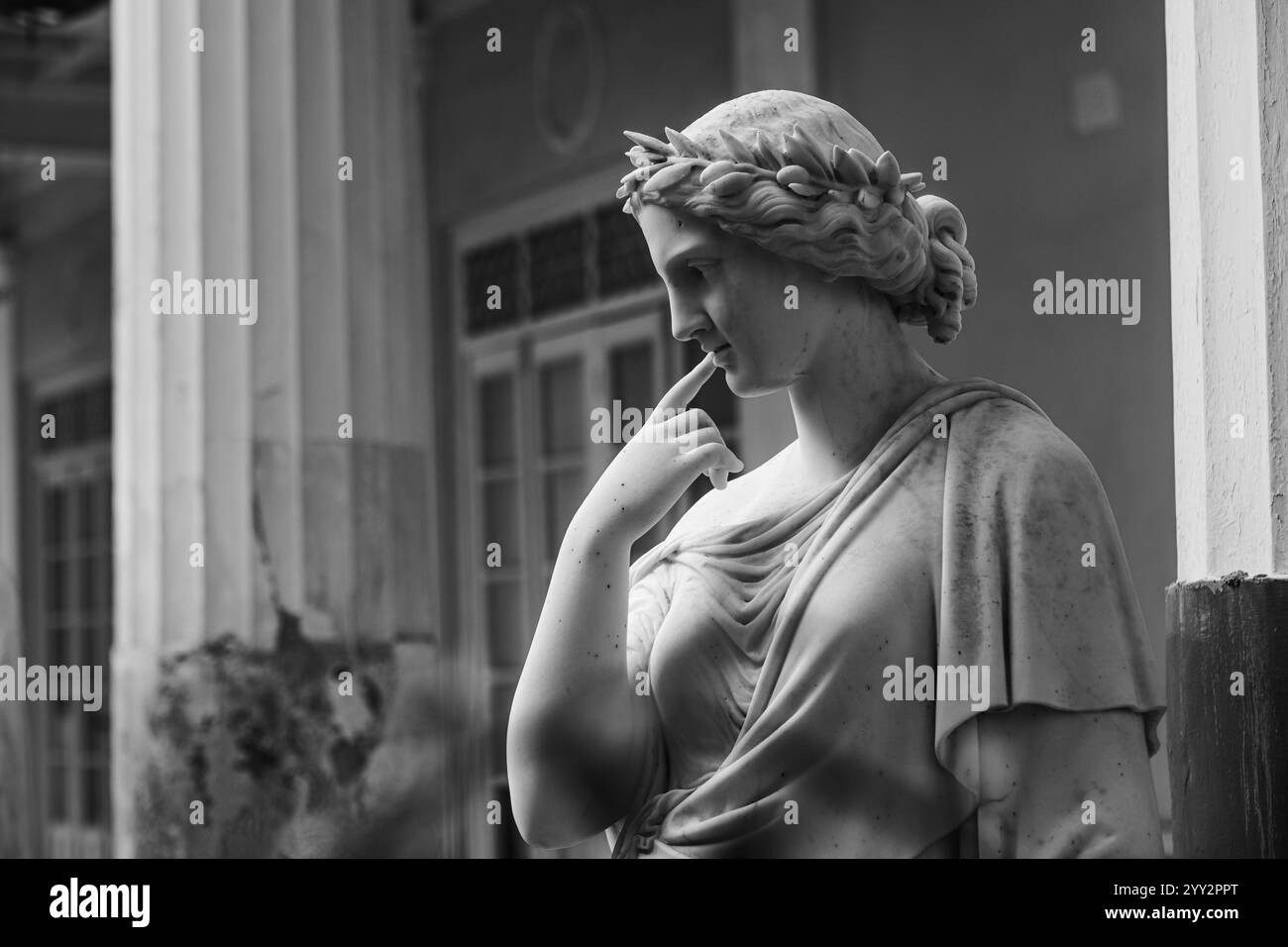 Antique statues of Women in Wreaths. The white stone statues stand in a ...