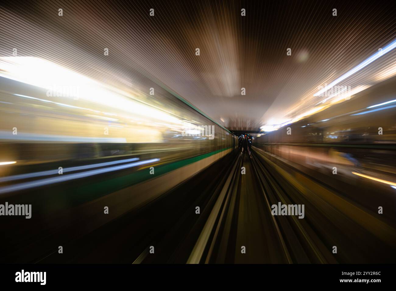 Motion blur of a subway tunnel. Motion-blurred photo from a subway car. Oncoming train, tunnel ...