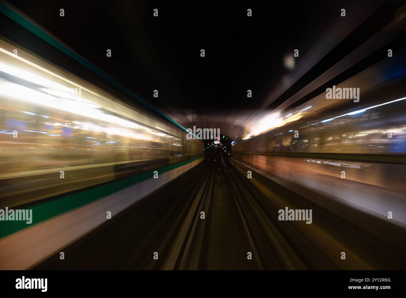 Motion blur of a subway tunnel. Motion-blurred photo from a subway car. Oncoming train, tunnel ...