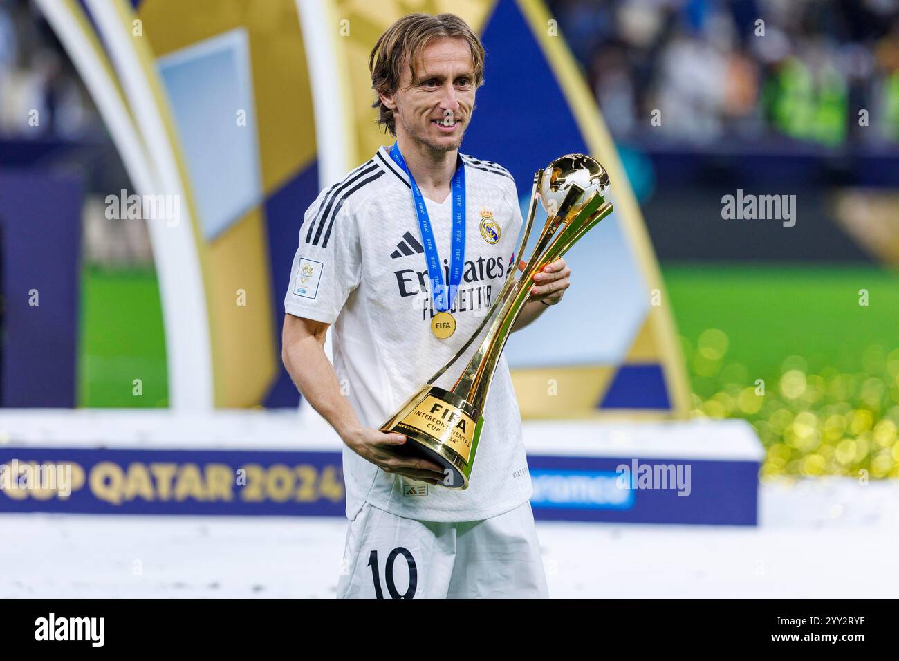 Doha, Qatar. 18th Dec, 2024. Real Madrid Luka Modric lifts the trophy ...