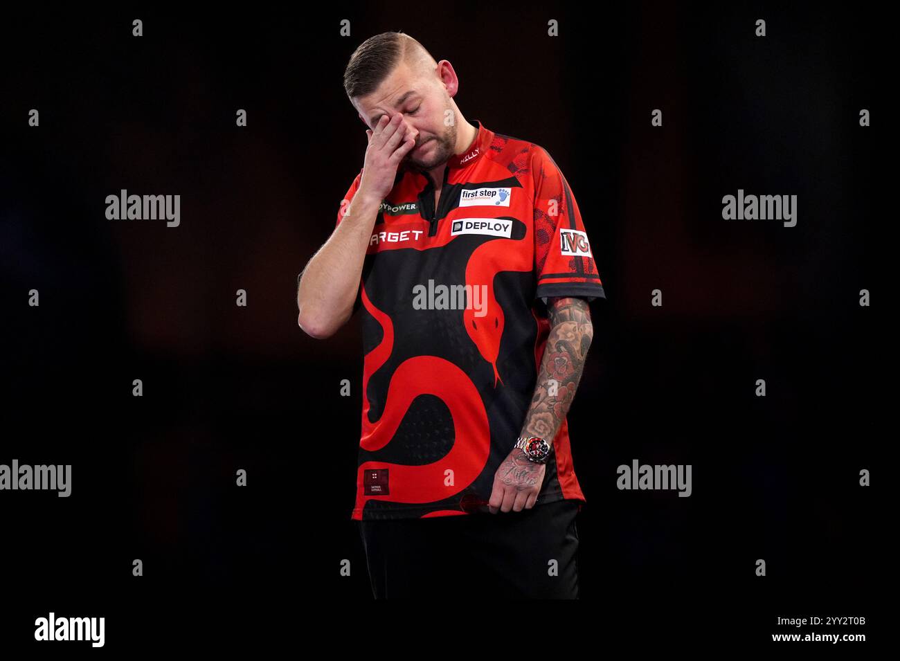 Nathan Aspinall reacts during his second round match against Leonard ...