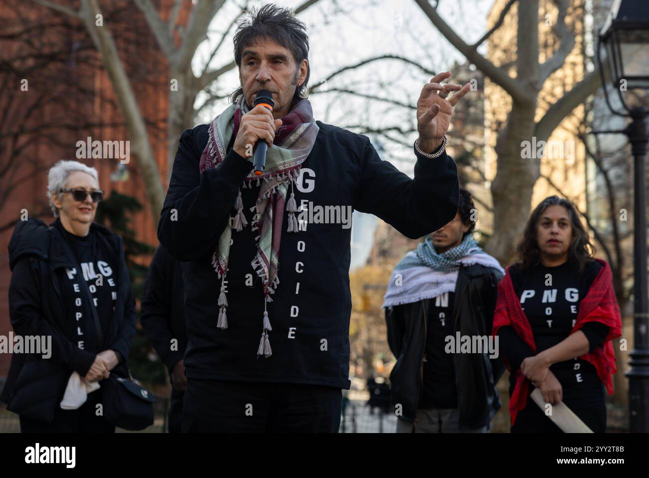 New York, USA. 18th Dec, 2024. Professor Andrew Ross speaks to a crowd ...