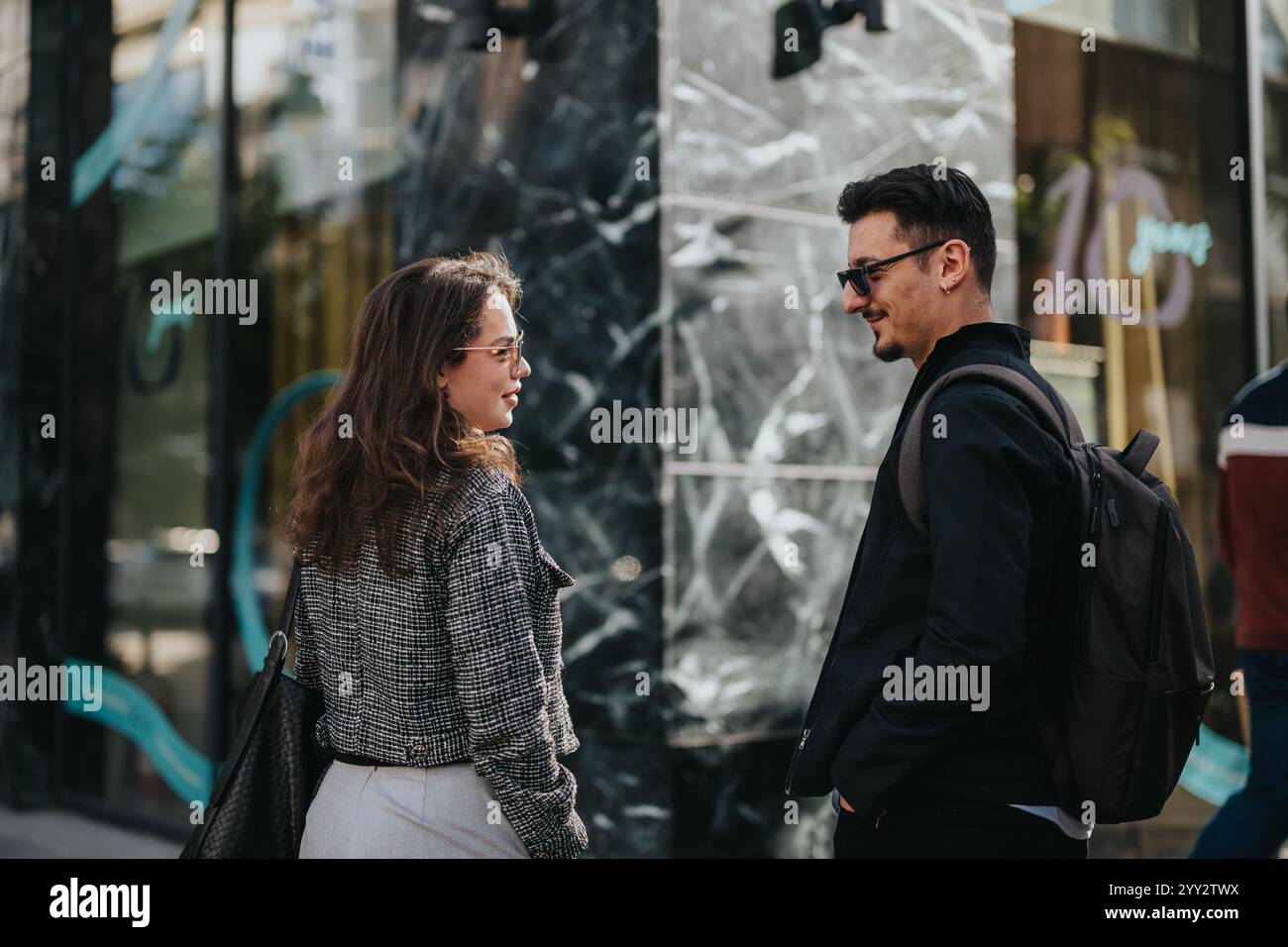 Business people having a conversation outside modern building Stock ...