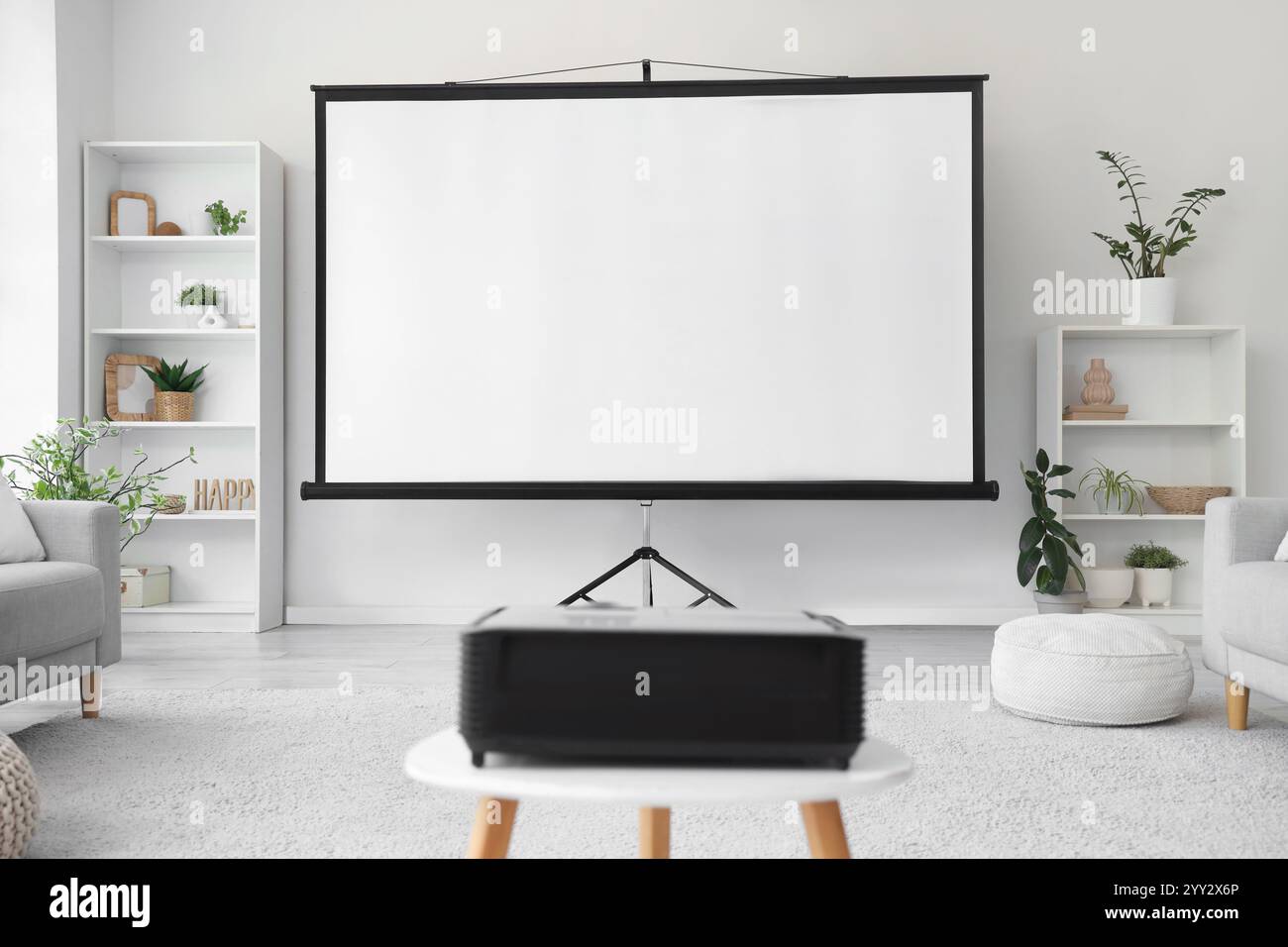 Interior of light room with projector screen and shelf units Stock ...