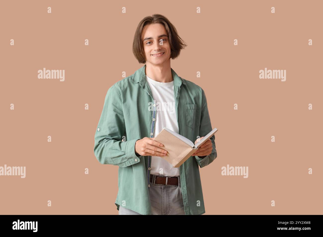 Teenage guy reading book hi-res stock photography and images - Alamy
