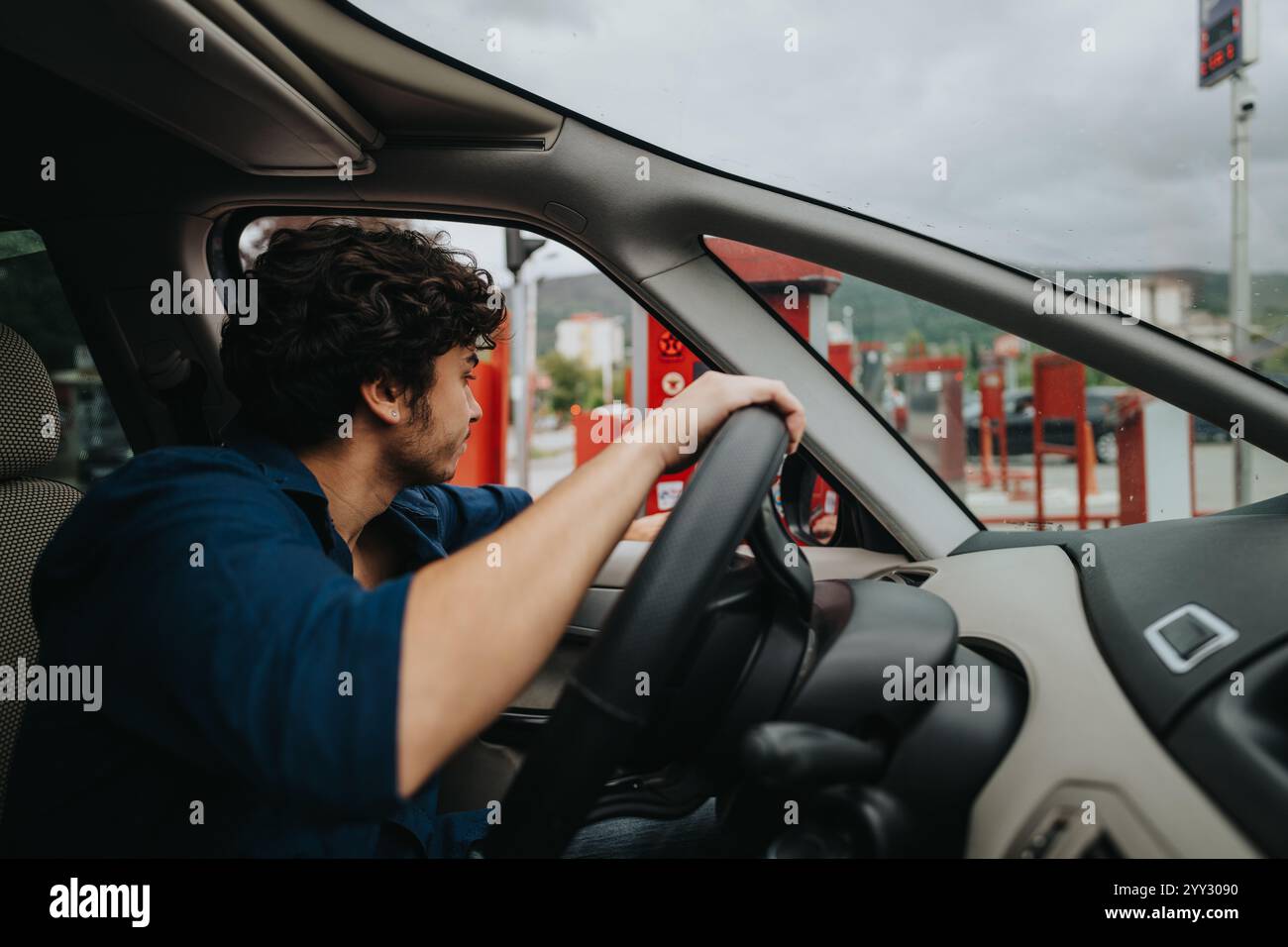 Man driving car through parking hi-res stock photography and images - Alamy