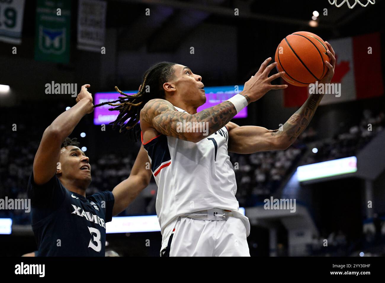 UConn guard Solo Ball (1) goes up to the basket as Xavier guard Dailyn ...
