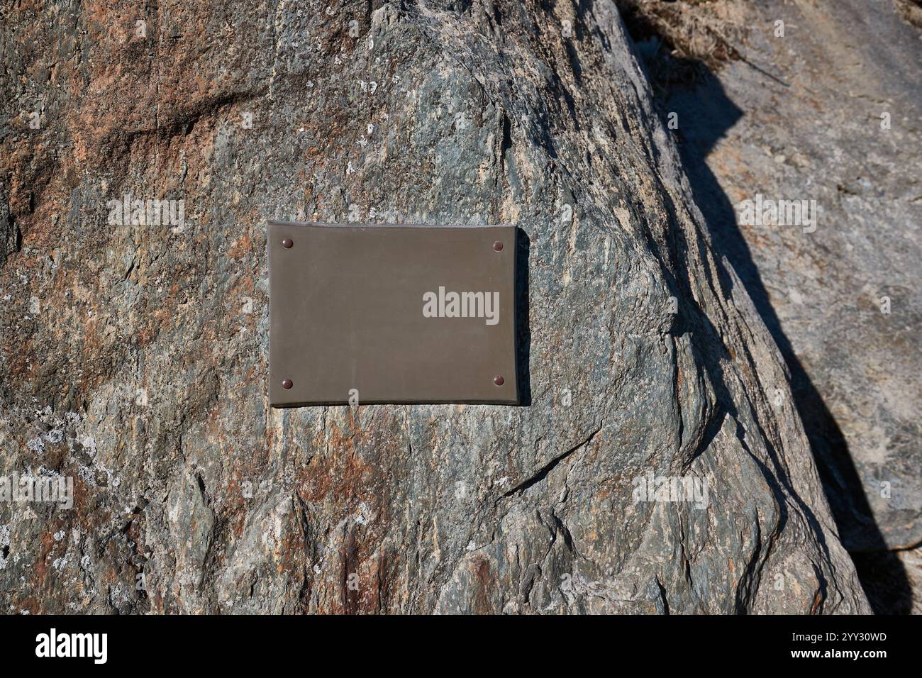 Memorial plate or information sigh on cliff surface Stock Photo - Alamy