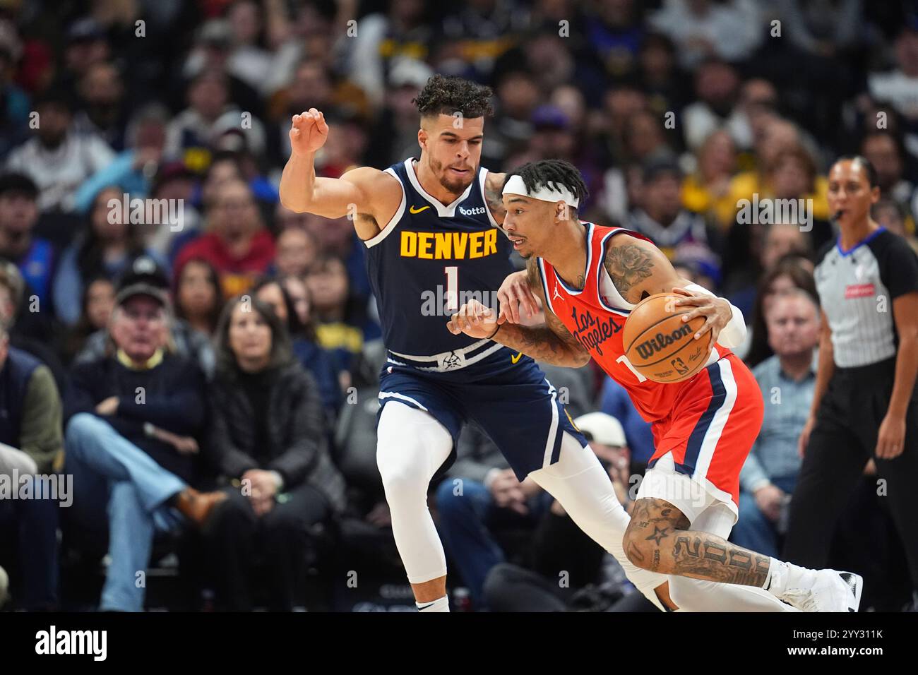 Los Angeles Clippers guard Jordan Miller (11) and Denver Nuggets ...