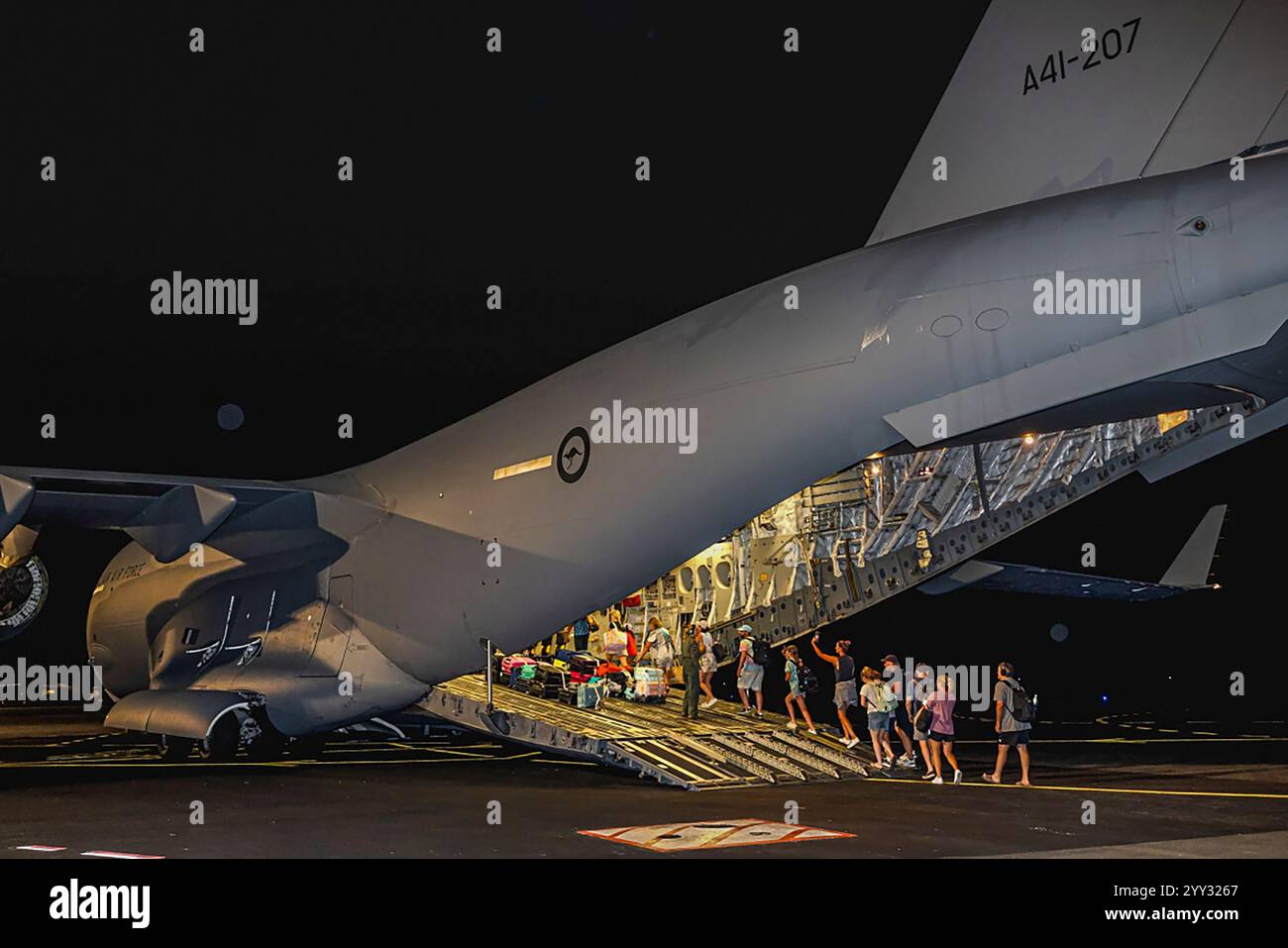 In this photo released by Australian Department of Defence, Australian citizens board a Royal ...