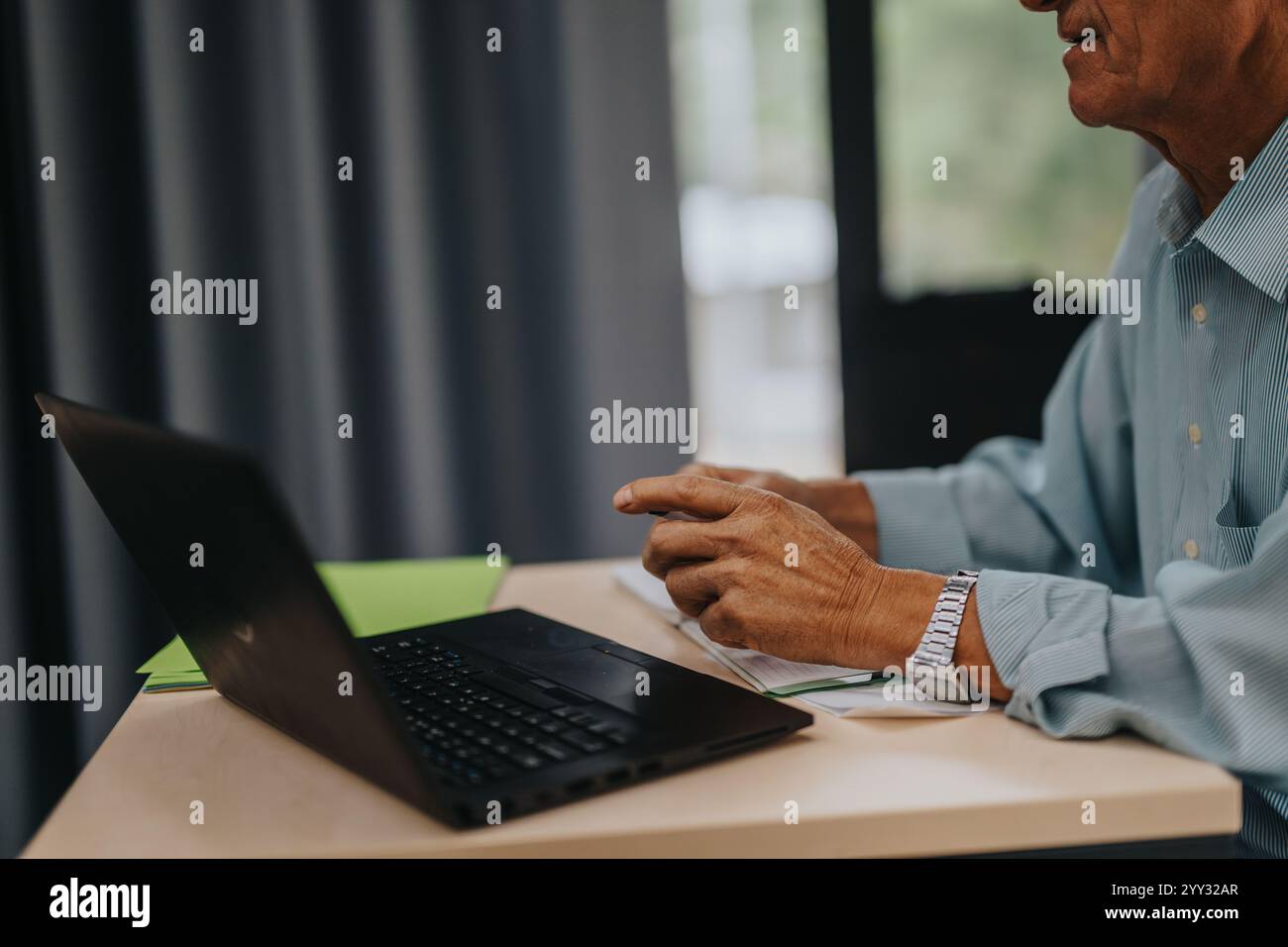Senior professor preparing for lecture at a cozy classroom Stock Photo ...
