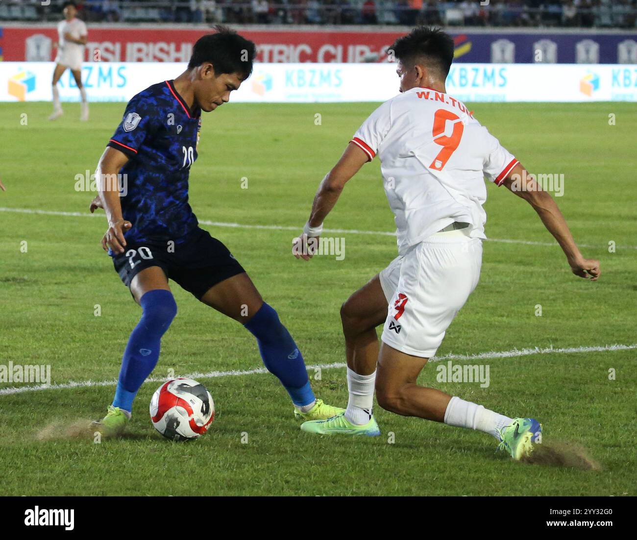 Yangon, Myanmar. 18th Dec, 2024. Win Naing Tun (R) of Myanmar vies with ...