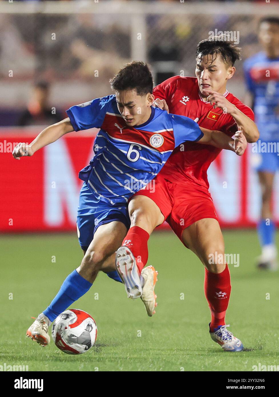 Manila, Philippines. 18th Dec, 2024. Sandro Miguel Sison Reyes (L) of the Philippines vies with ...