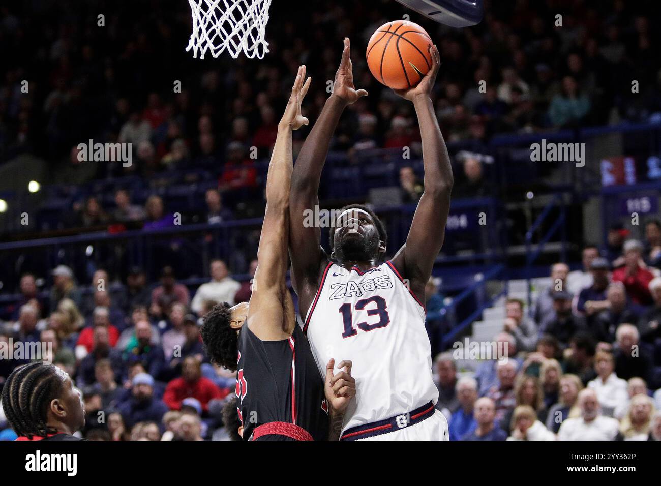 Gonzaga forward Graham Ike (13) shoots while pressured by Nicholls ...