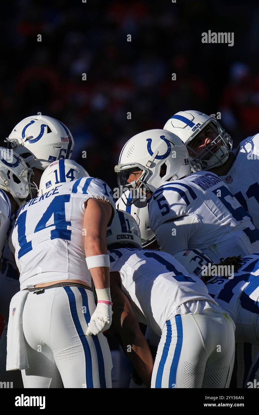 The Indianapolis Colts offense breaks a huddle against the Denver ...