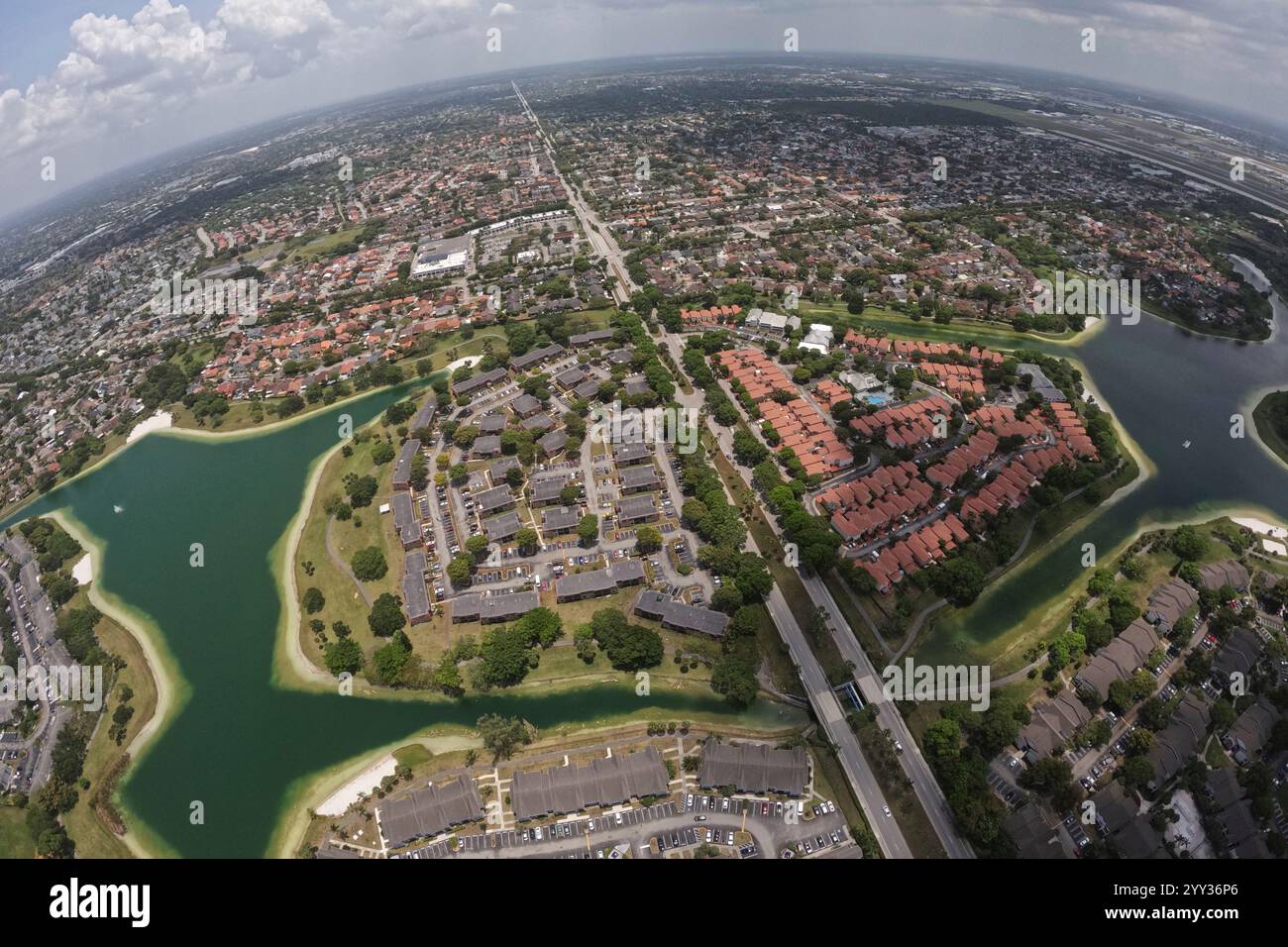Housing developments are seen amid artificial lakes on the western side ...