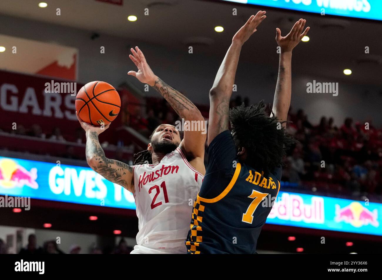Houston guard Emanuel Sharp (21) shoots against Toledo guard Isaiah ...