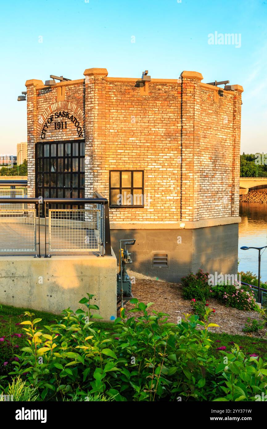 A brick building with a window on the side. The building is old and has ...