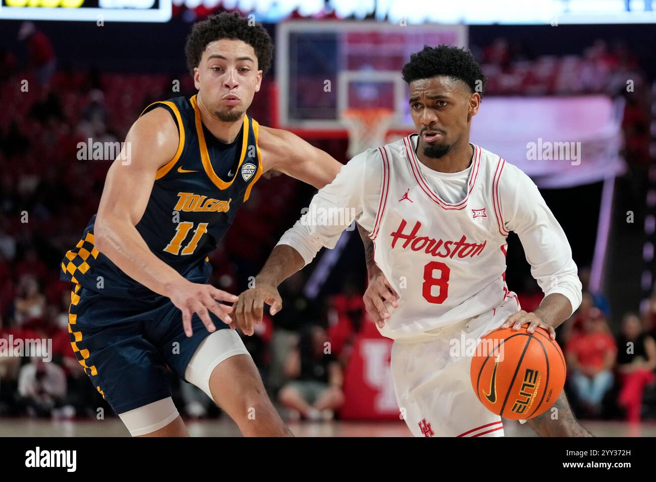 Toledo guard Sam Lewis (11) defends against Houston guard Mylik Wilson ...
