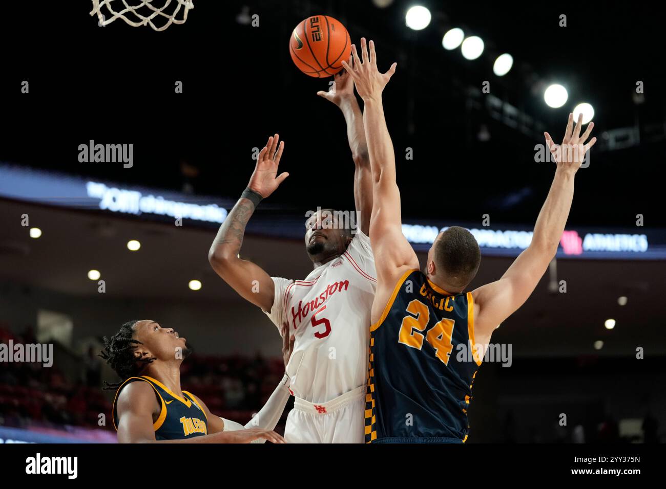 Houston forward Ja'Vier Francis (5) shoots against Toledo guard Seth ...