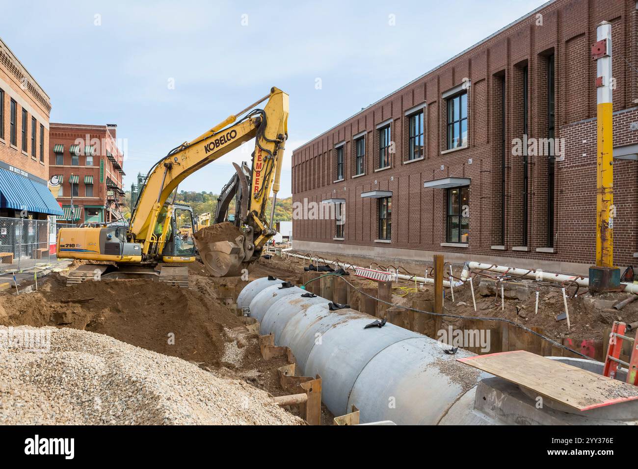 Construction crew upgrading sewer lines in small downtown area Stock ...