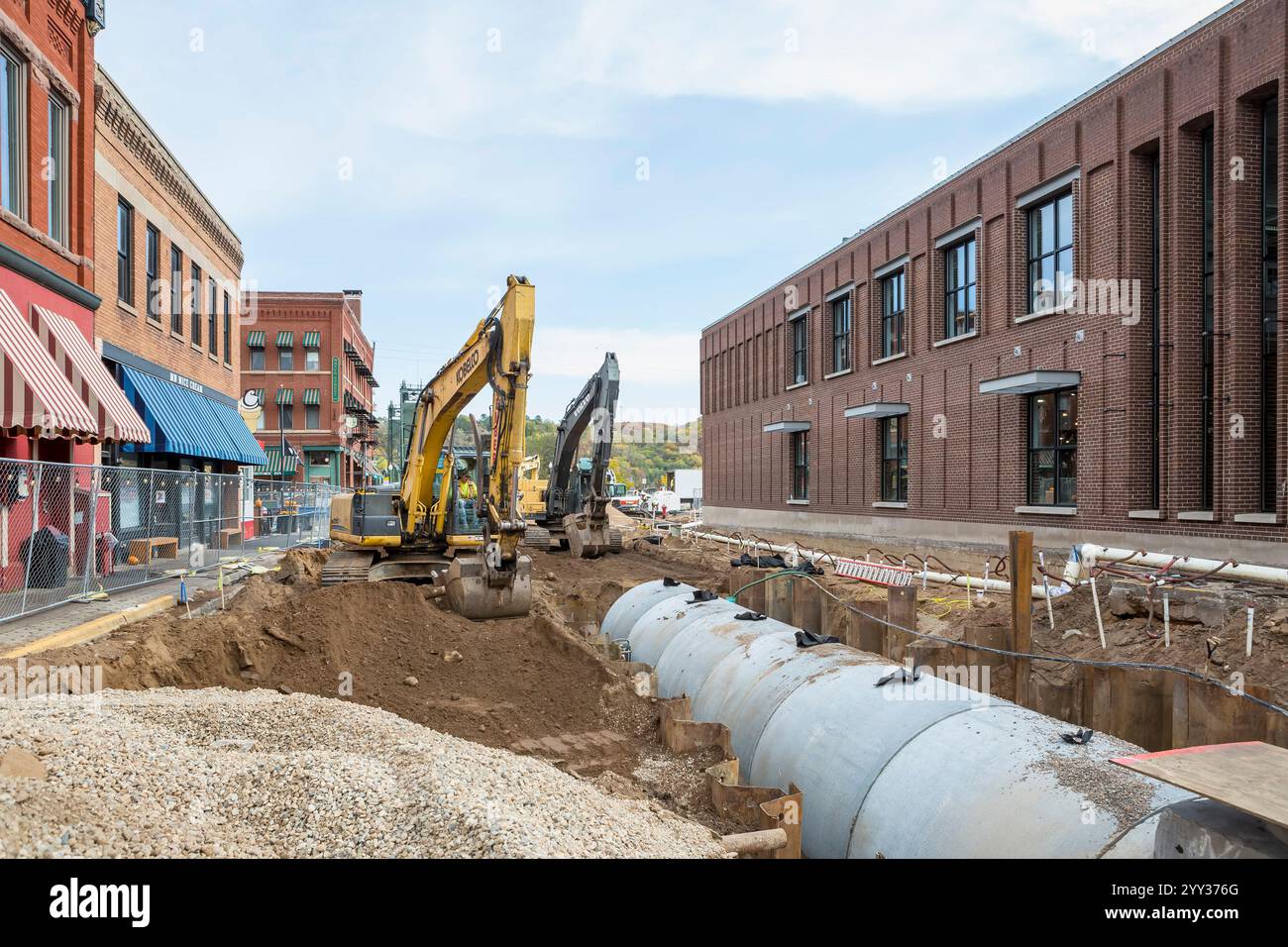 Construction crew upgrading sewer lines in small downtown area Stock ...