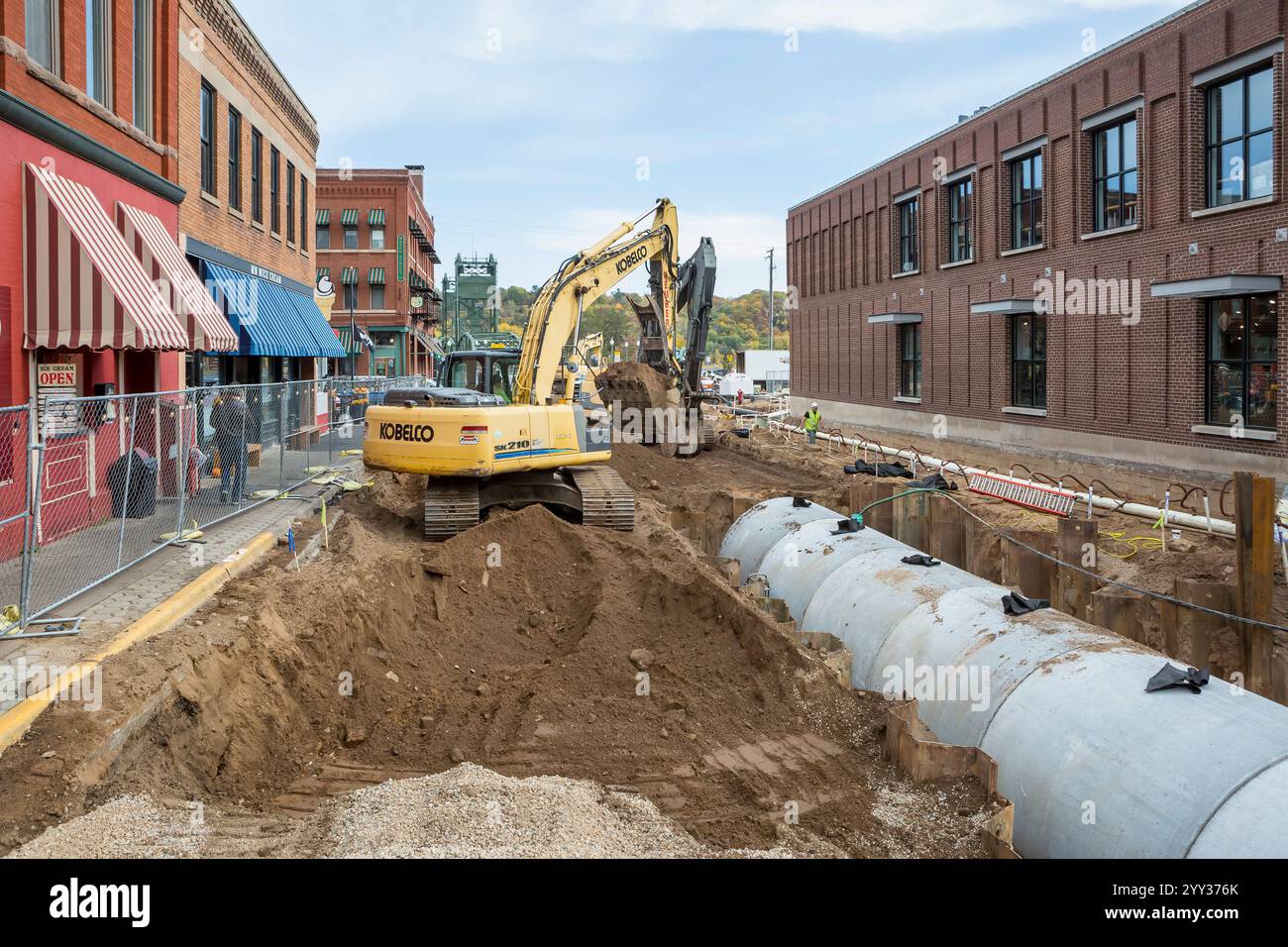 Construction crew upgrading sewer lines in small downtown area Stock ...