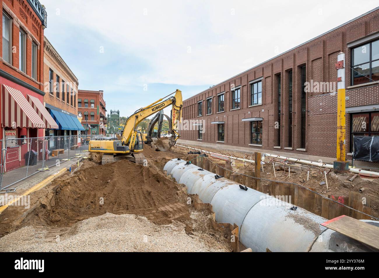 Construction crew upgrading sewer lines in small downtown area Stock ...
