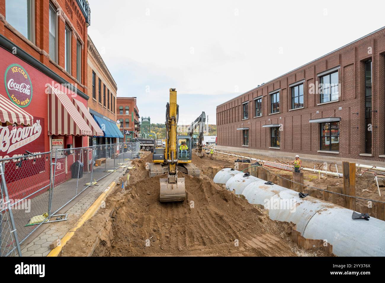 Construction crew upgrading sewer lines in small downtown area Stock ...