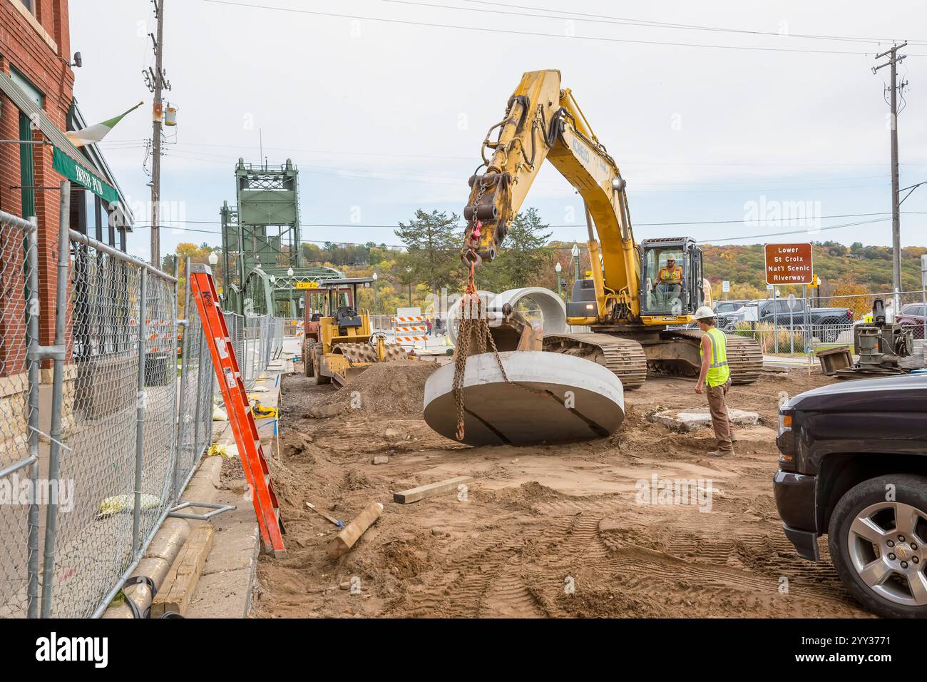 Construction crew upgrading sewer lines in small downtown area Stock ...