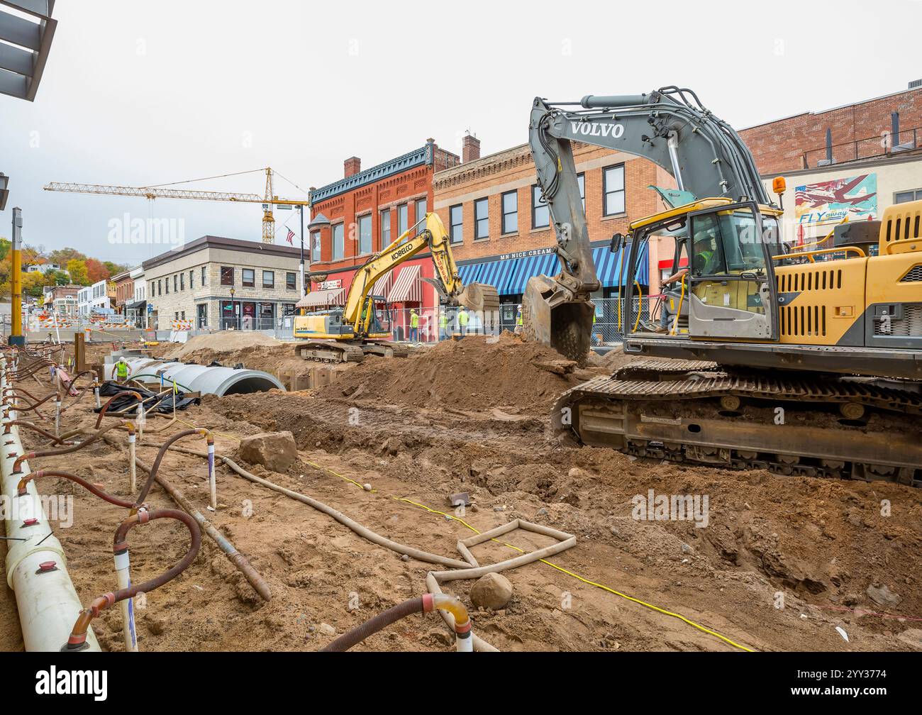 Construction crew upgrading sewer lines in small downtown area Stock ...