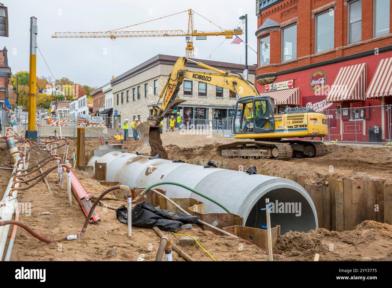 Construction crew upgrading sewer lines in small downtown area Stock ...