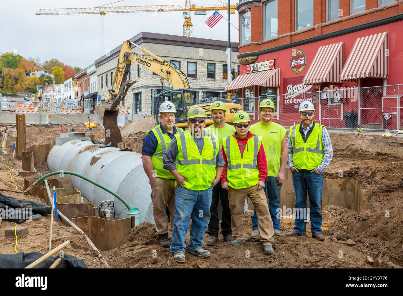 Construction crew upgrading sewer lines in small downtown area Stock ...