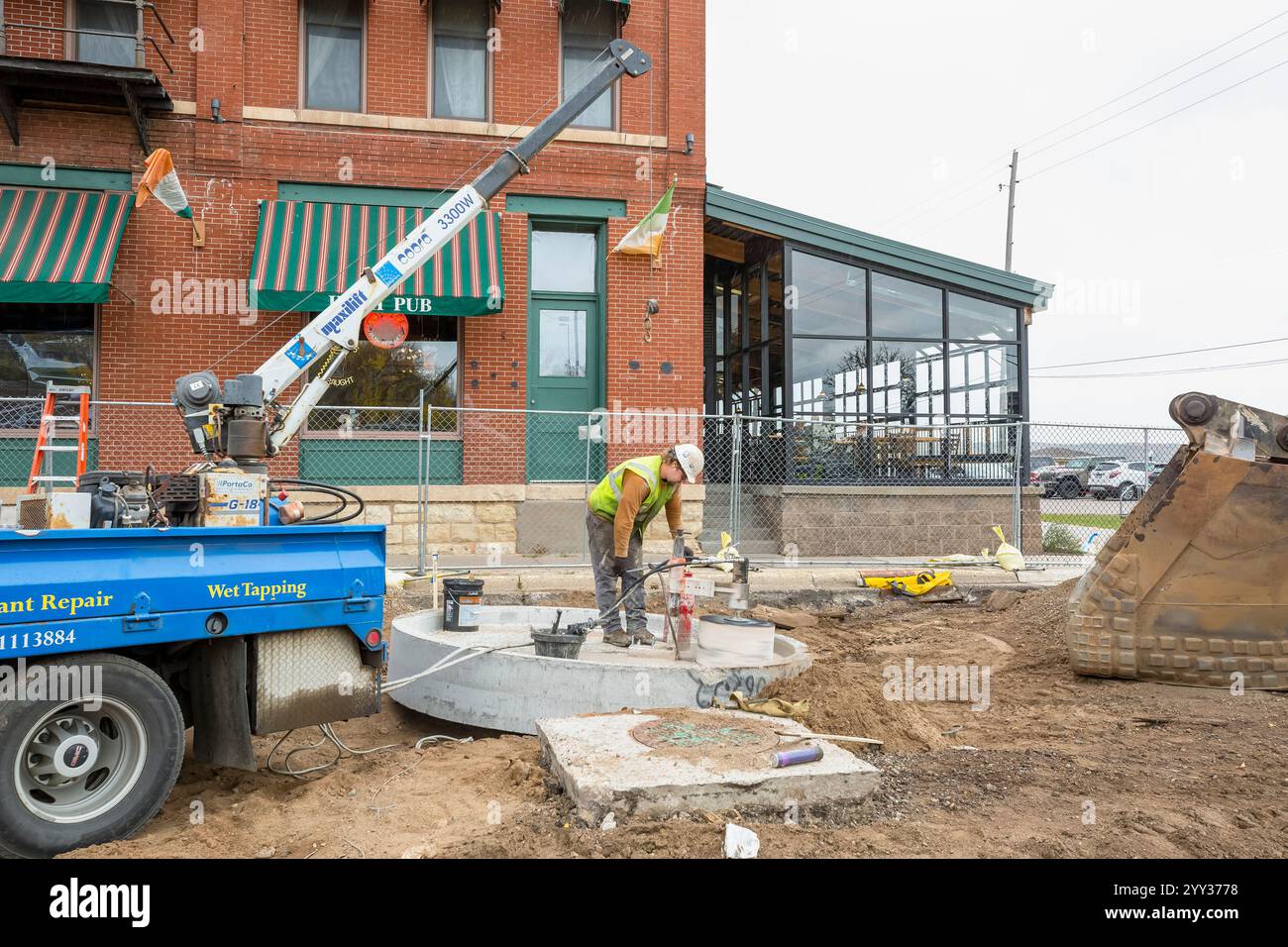Construction crew upgrading sewer lines in small downtown area Stock ...