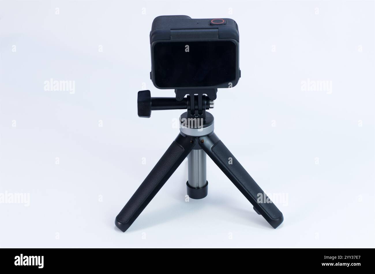 Compact Action Camera on Tripod Against a White Studio Background Stock ...