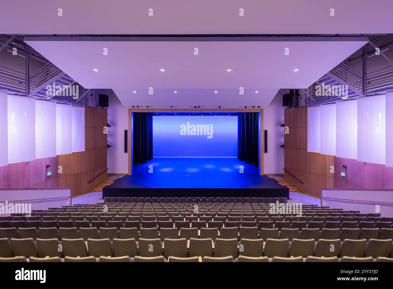 New auditorium in middle school with colorful lighting on walls and ...