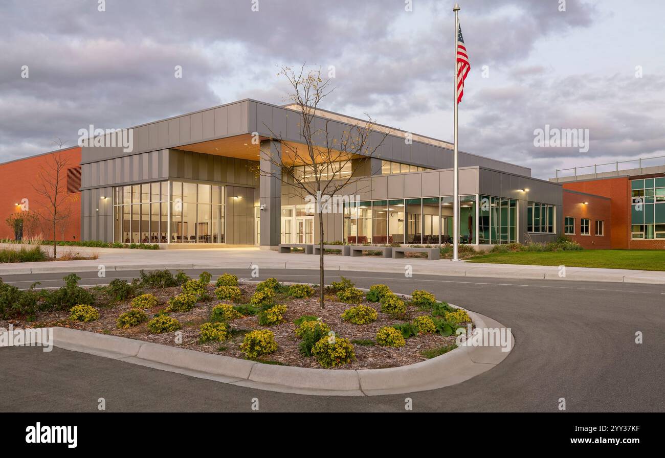 Closer view of front entrance at middle school with large windows and ...