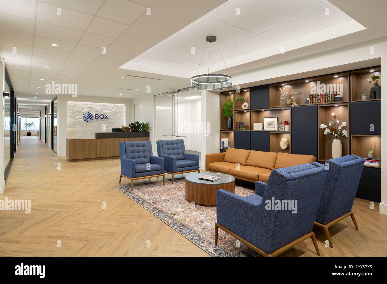 Reception and front desk area in office space with seating area and ...