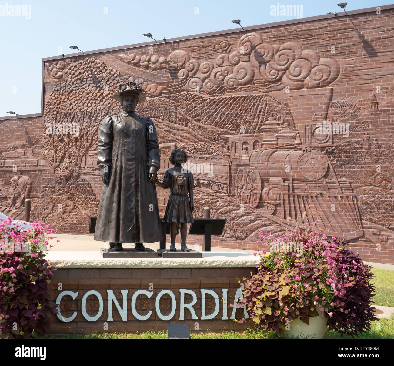 Statue of orphan placement agent Anna Laura Hill standing with an ...
