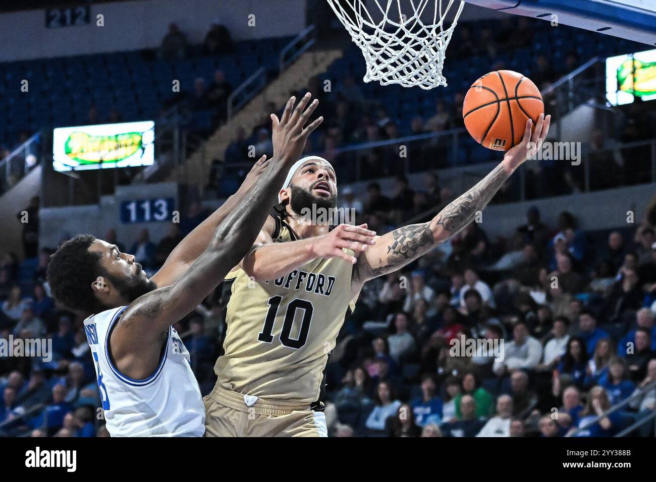 DECEMBER 18, 2024: Wofford Terriers guard Corey Tripp (10) lays up a ...
