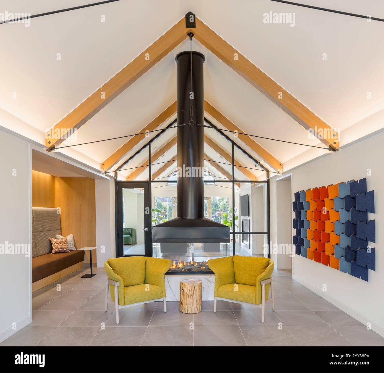 Apartment clubhouse with cathedral ceiling and freestanding fireplace ...