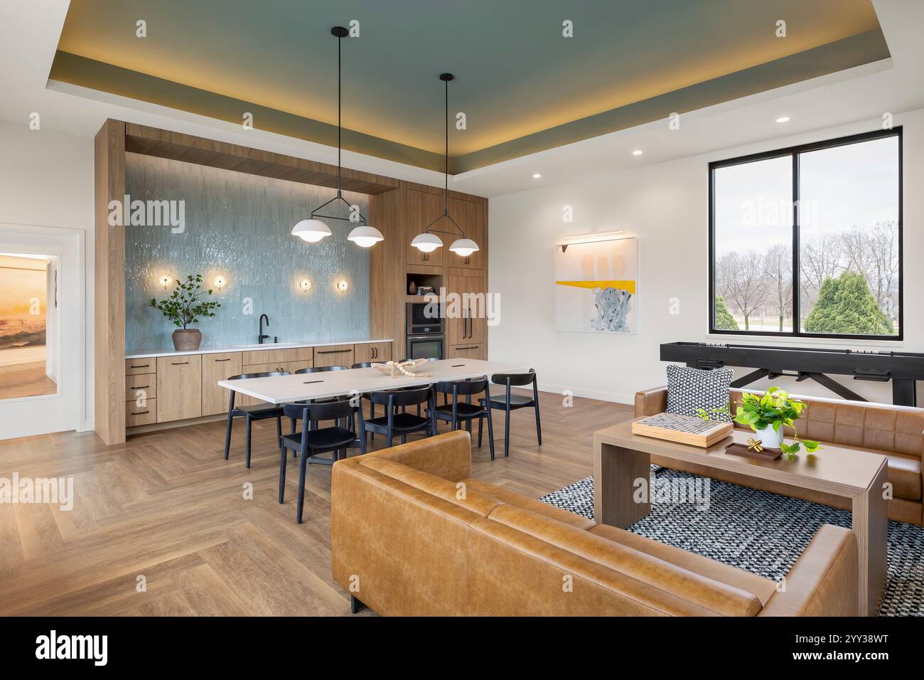 Community room in apartment building with large dining table hi-res ...