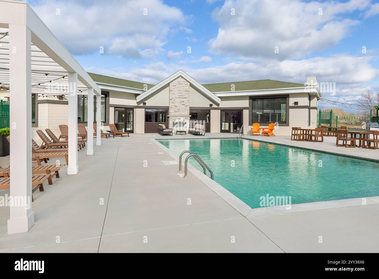Pool area outside apartment complex community center Stock Photo - Alamy