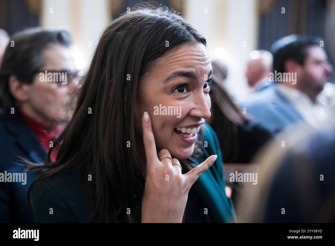 Rep. Alexandria Ocasio-Cortez (D-N.Y.) speaks with guests after a ...