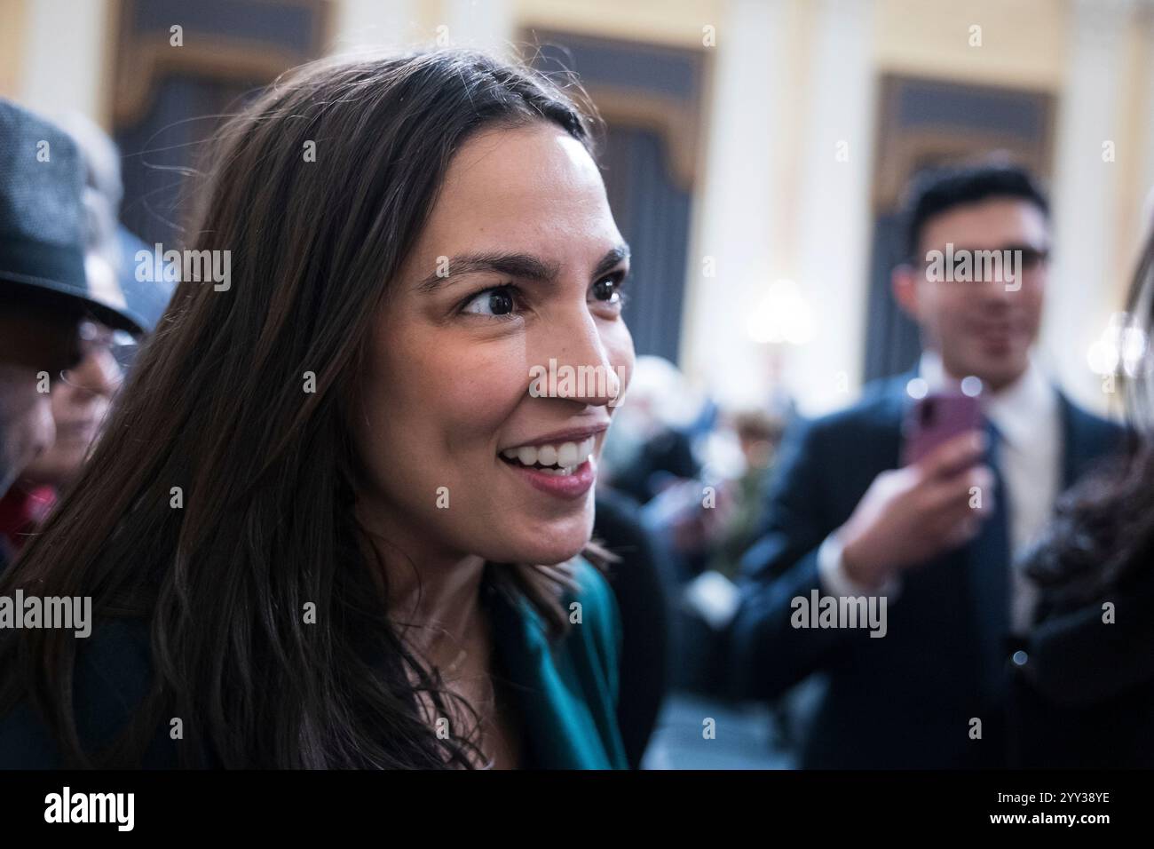 Rep. Alexandria Ocasio-Cortez (D-N.Y.) speaks with guests after a ...