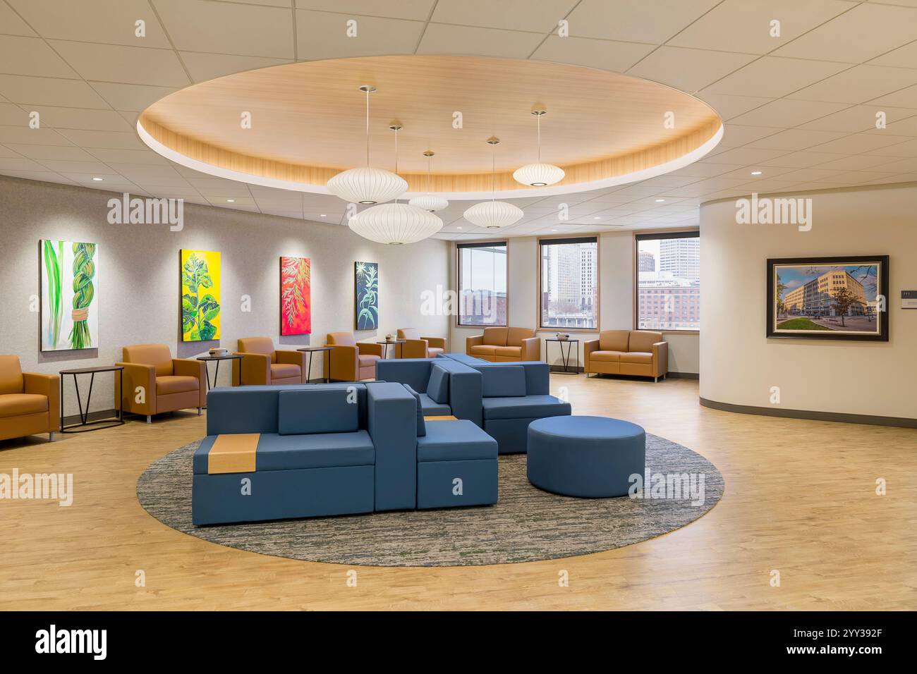 Lobby of healthcare clinic with round tray ceiling and colorful modular ...