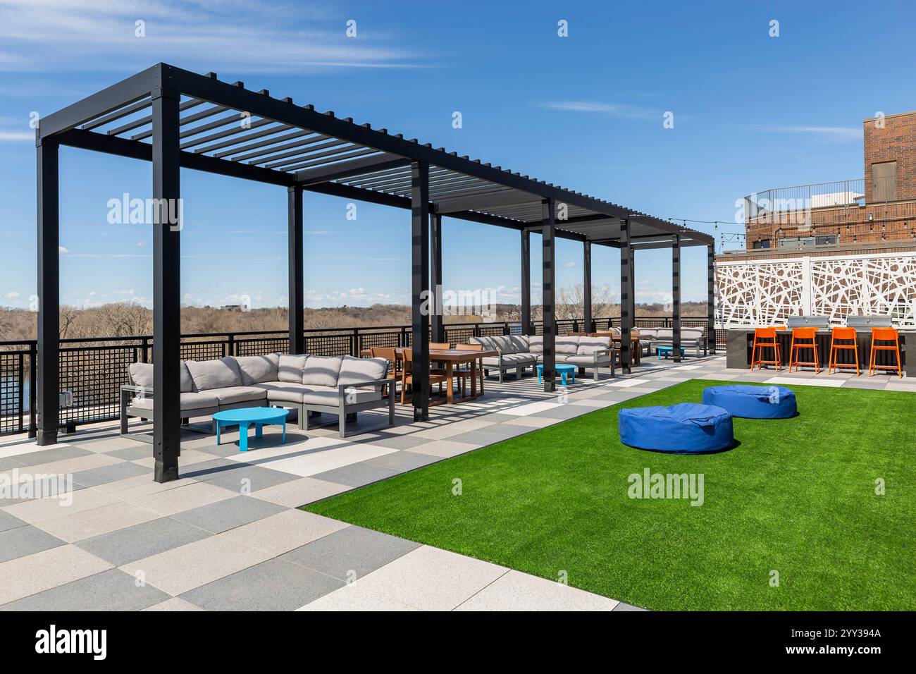 Apartment building roof deck showing pergola with seating and grill ...