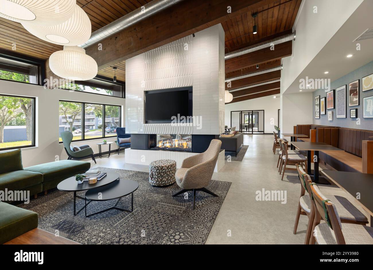 Fireplace and seating area in community room of apartment comple hi-res ...