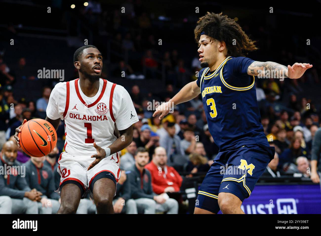 Oklahoma guard Kobe Elvis (1) looks to shoot against Michigan guard Tre ...