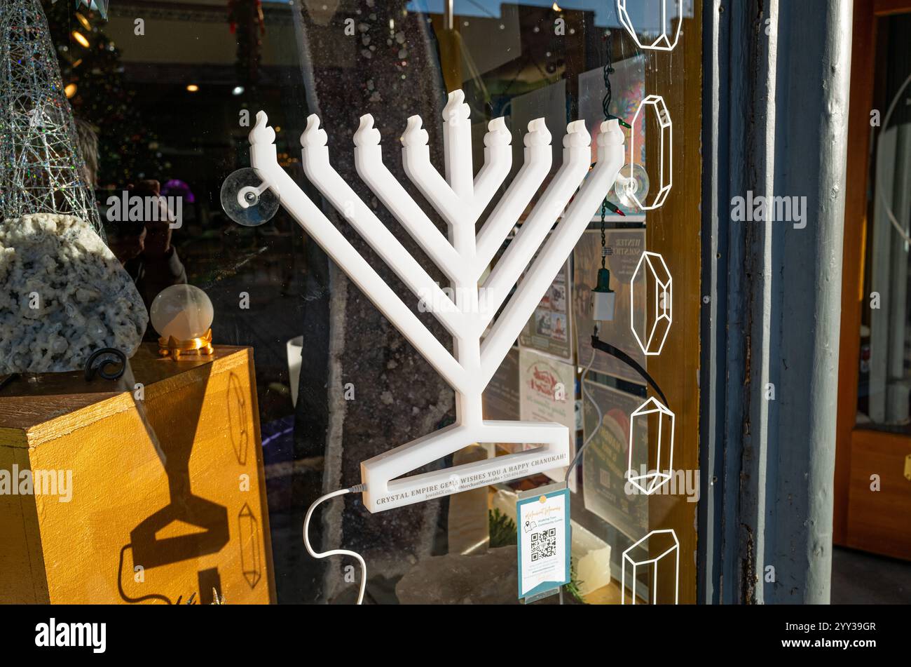 A menorah in a shop window, one of many throughout Grass Valley's ...